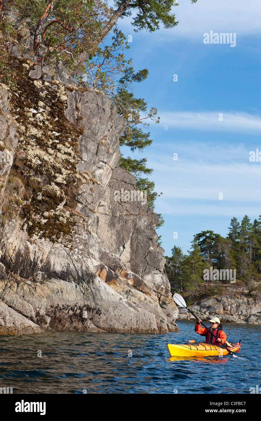 Hispanic woman kayaking on lake Stock Photo - Alamy