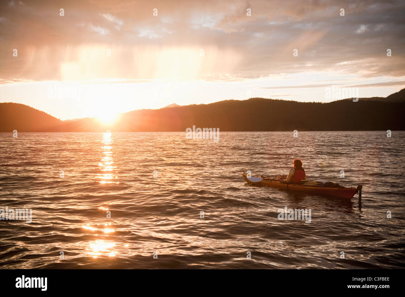 Hispanic woman kayaking on lake Stock Photo - Alamy