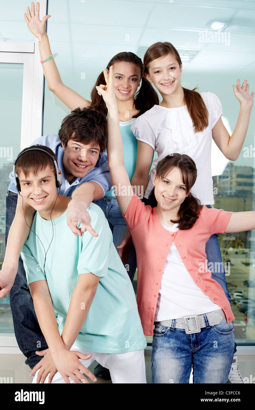 Five happy friends posing before camera Stock Photo - Alamy