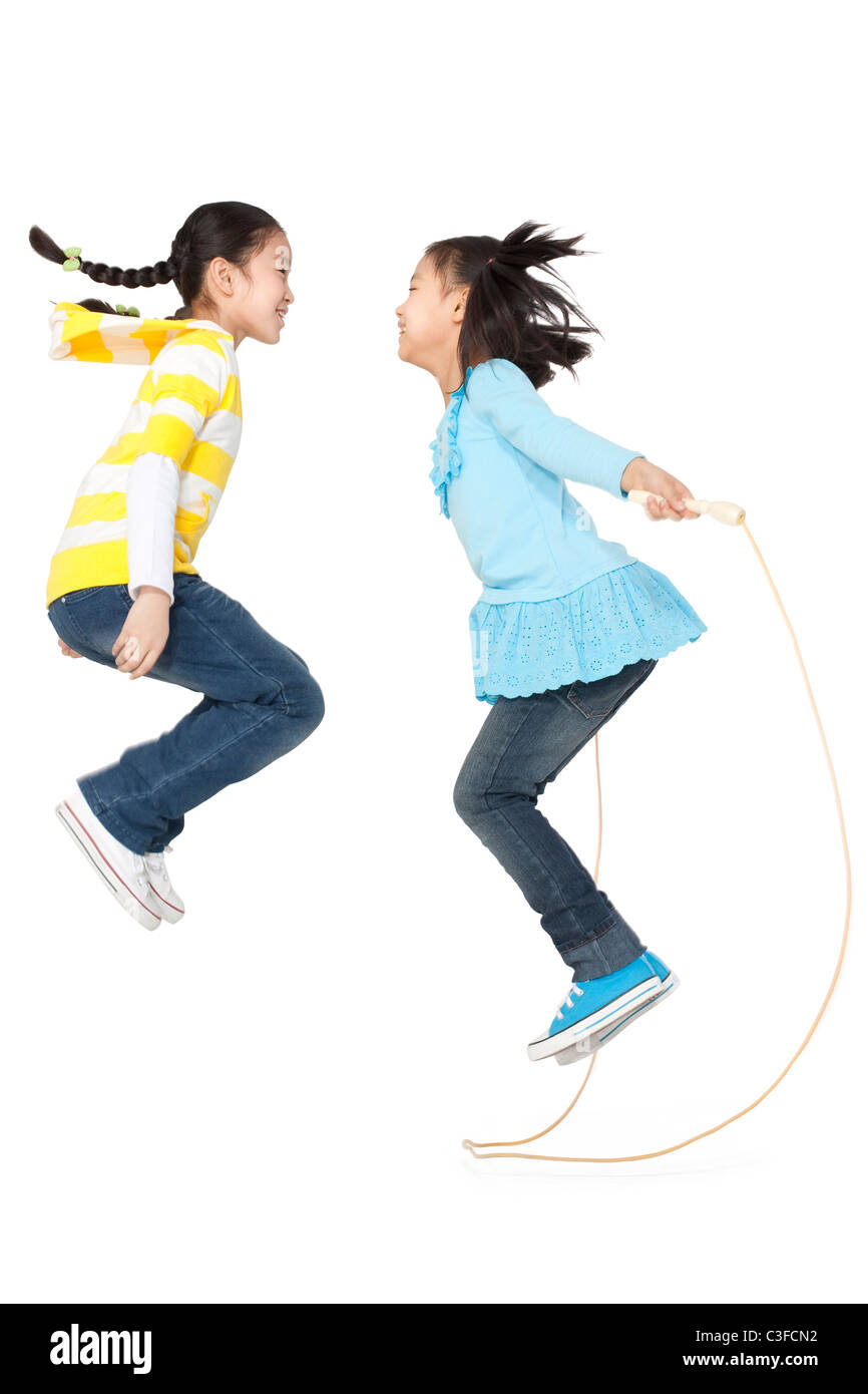 Two friends jump roping together Stock Photo - Alamy