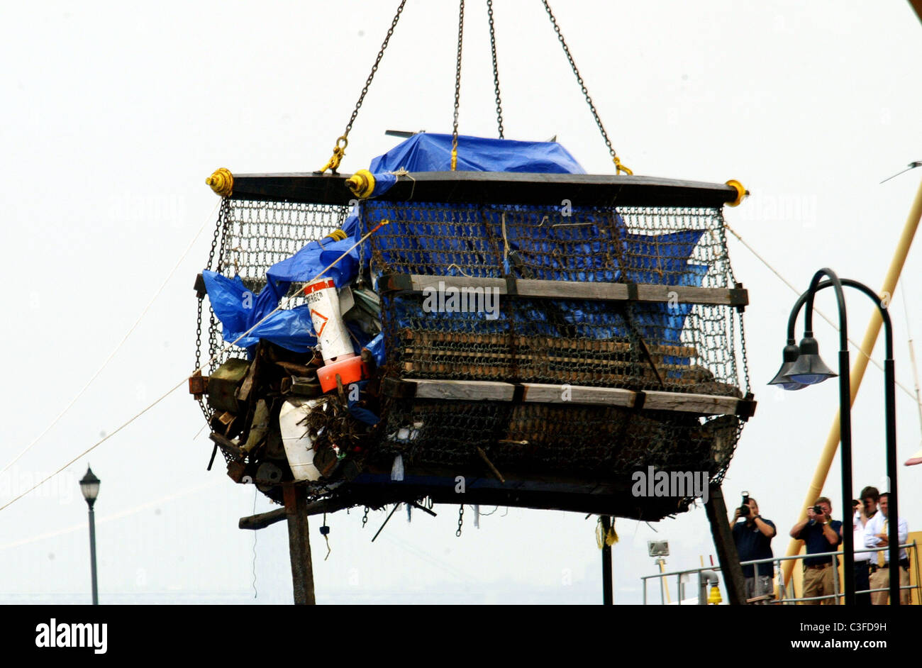 Recovery teams have pulled the wreckage of a helicopter out of the ...