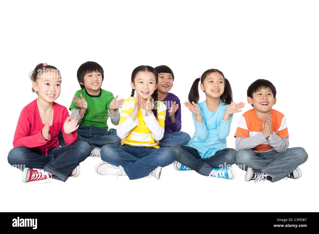A group of children clapping Stock Photo - Alamy