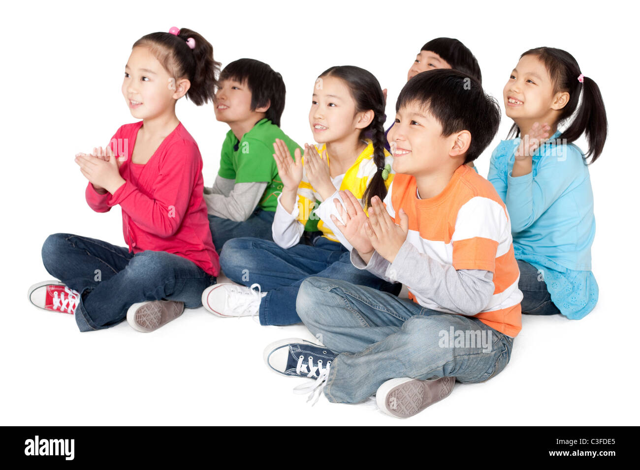 A group of children clapping Stock Photo - Alamy