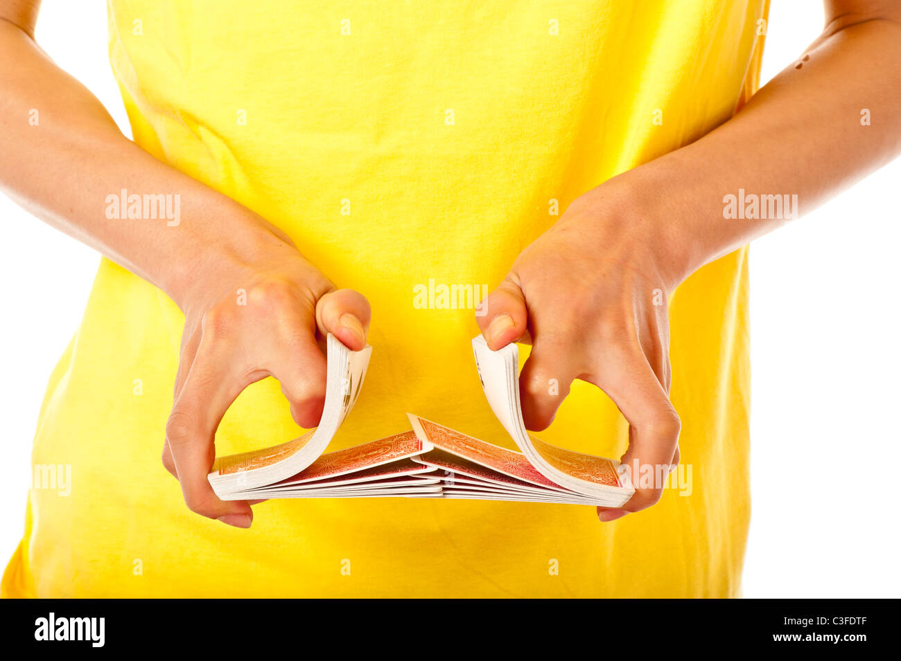 hands of teenage Chinese Asian boy shuffling deck of playing cards ...