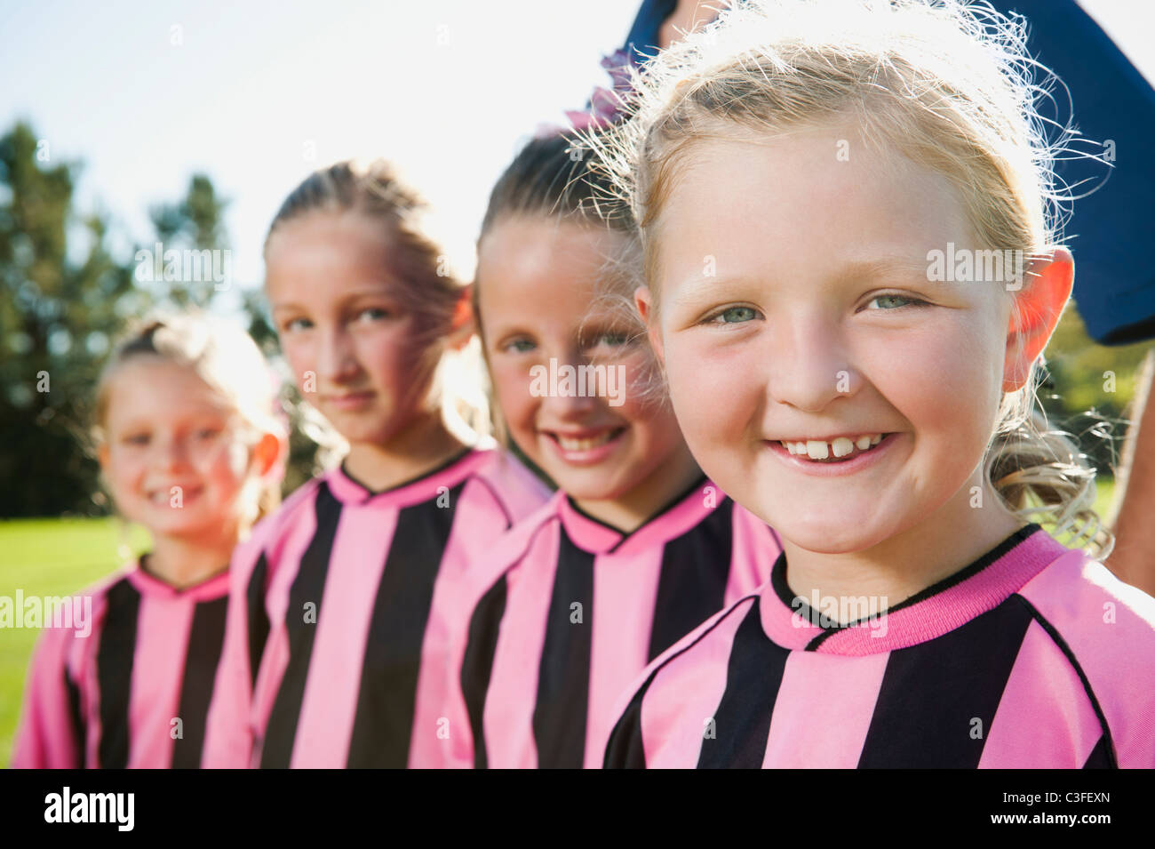 Caucasian girl soccer players smiling Stock Photo - Alamy