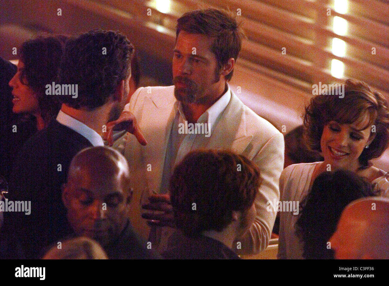 Brad Pitt deep in animated conversation with Eric Bana and Rachel ... Brad Pitt deep in animated conversation with Eric Bana and Rachel ...