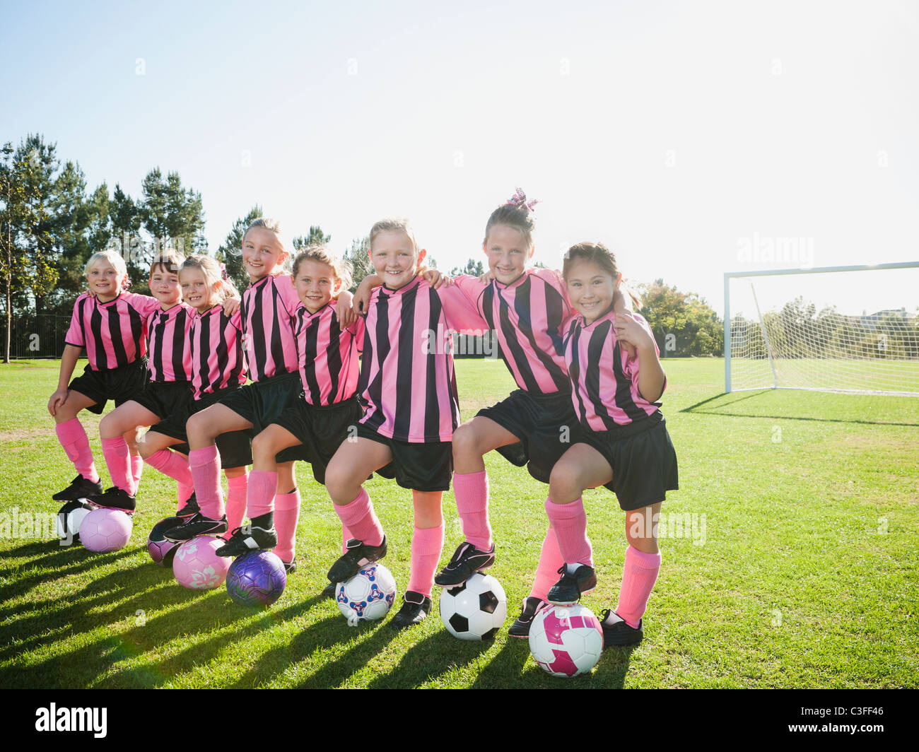 Girl soccer players standing in a row Stock Photo - Alamy