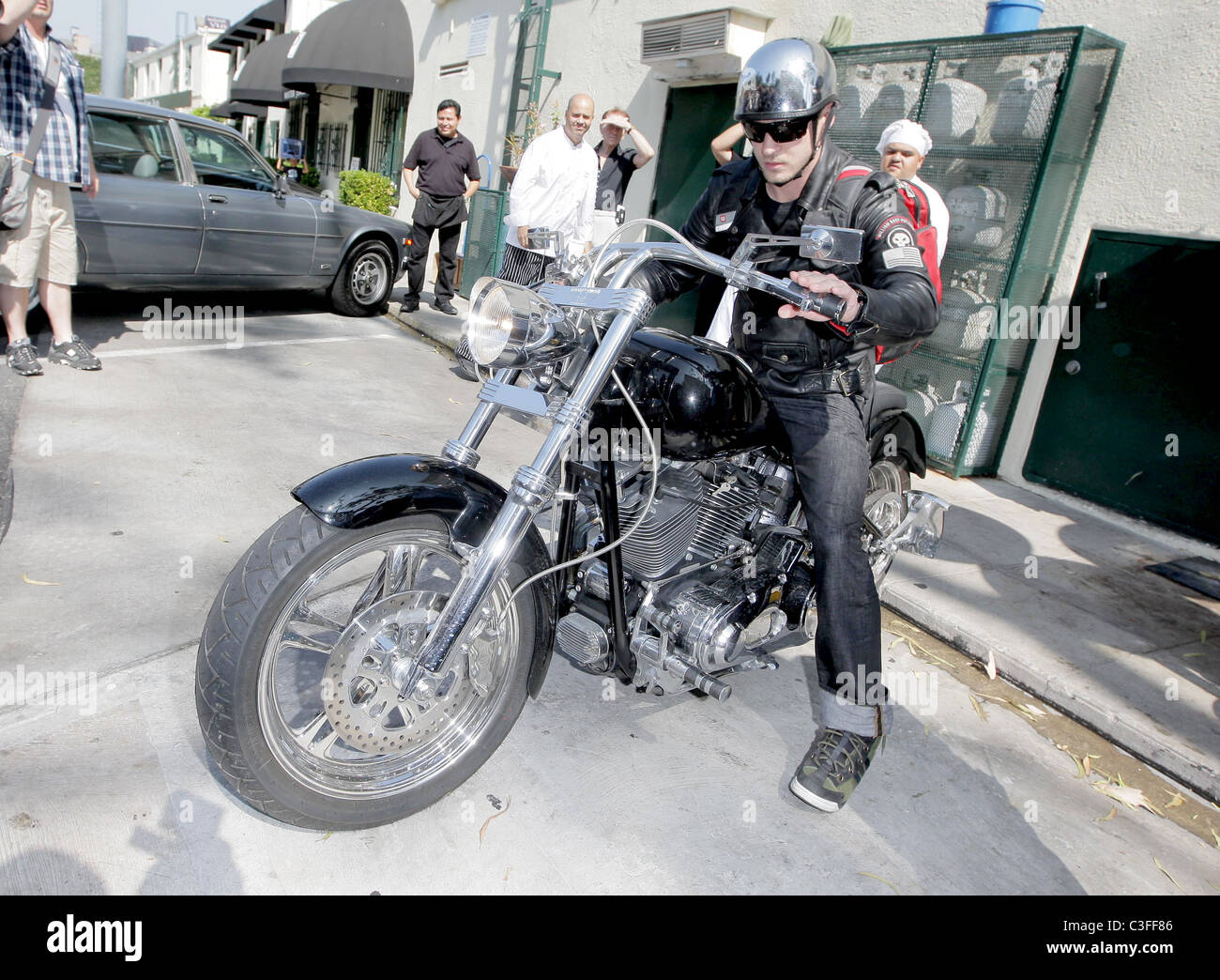 Justin Timberlake is surrounded by photographers as he leaves Cafe Med ...