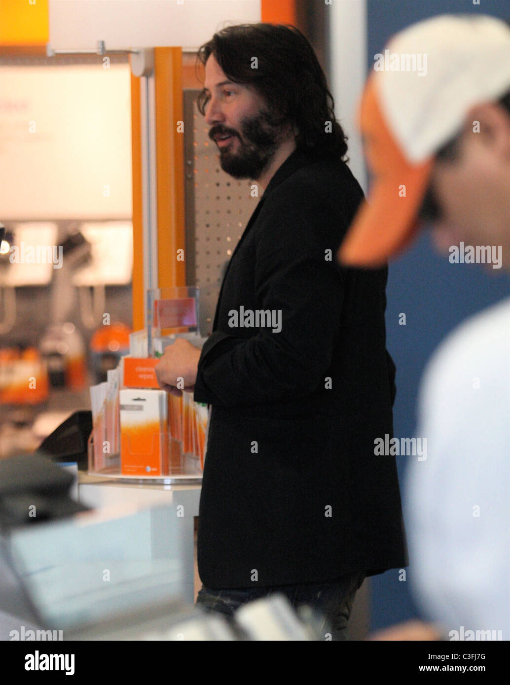 Keanu Reeves shopping at an AT&T store for a new cellphone while ...