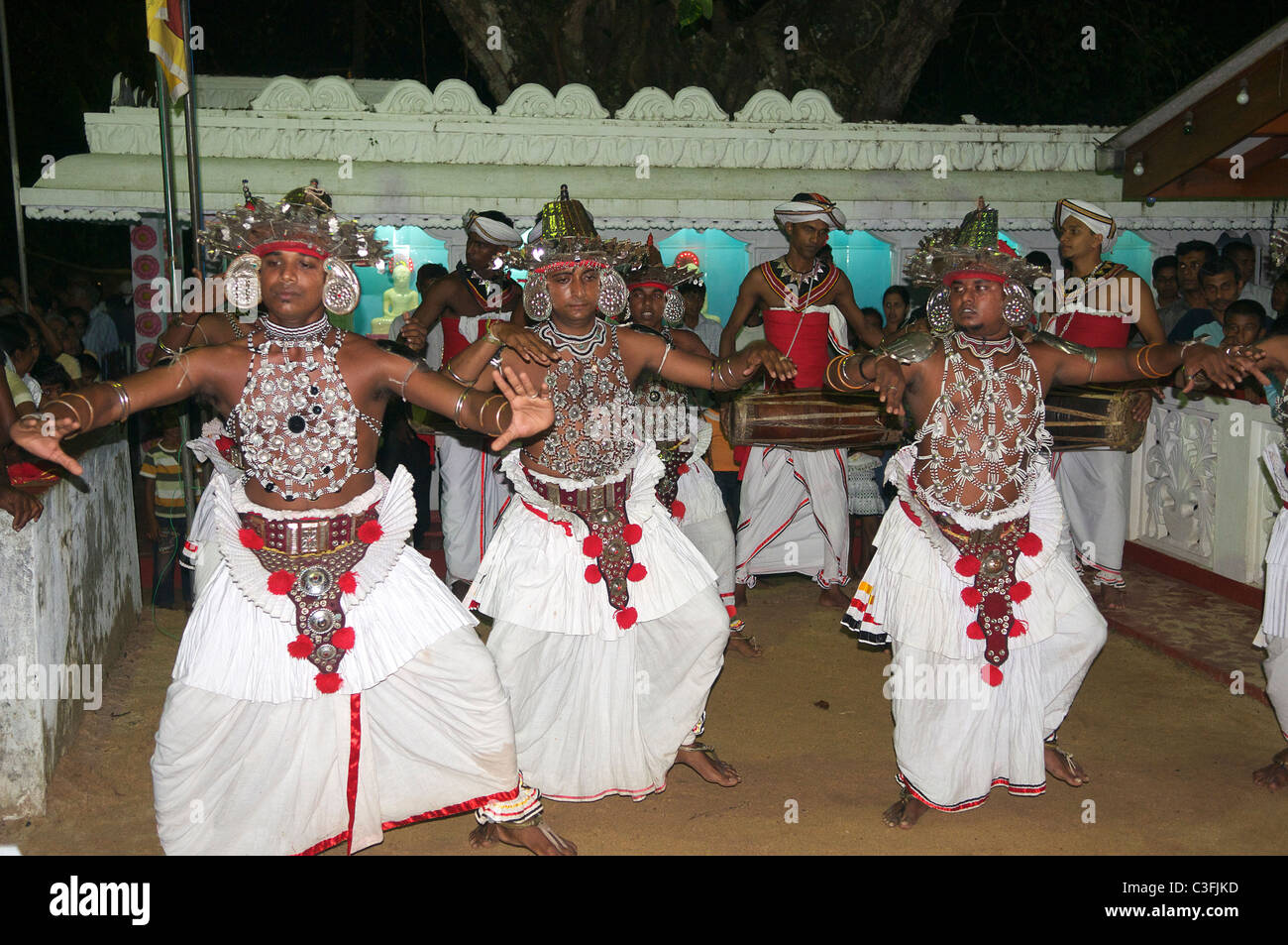 Male dancers at Poya or Full Moon Festival at Pilana Purana Temple near ...