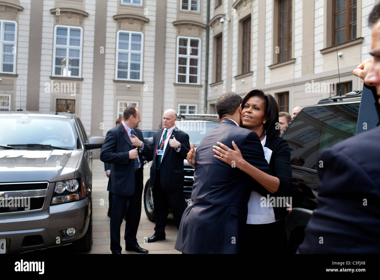 President Barack Obama and First Lady Michelle Obama embrace as they ...