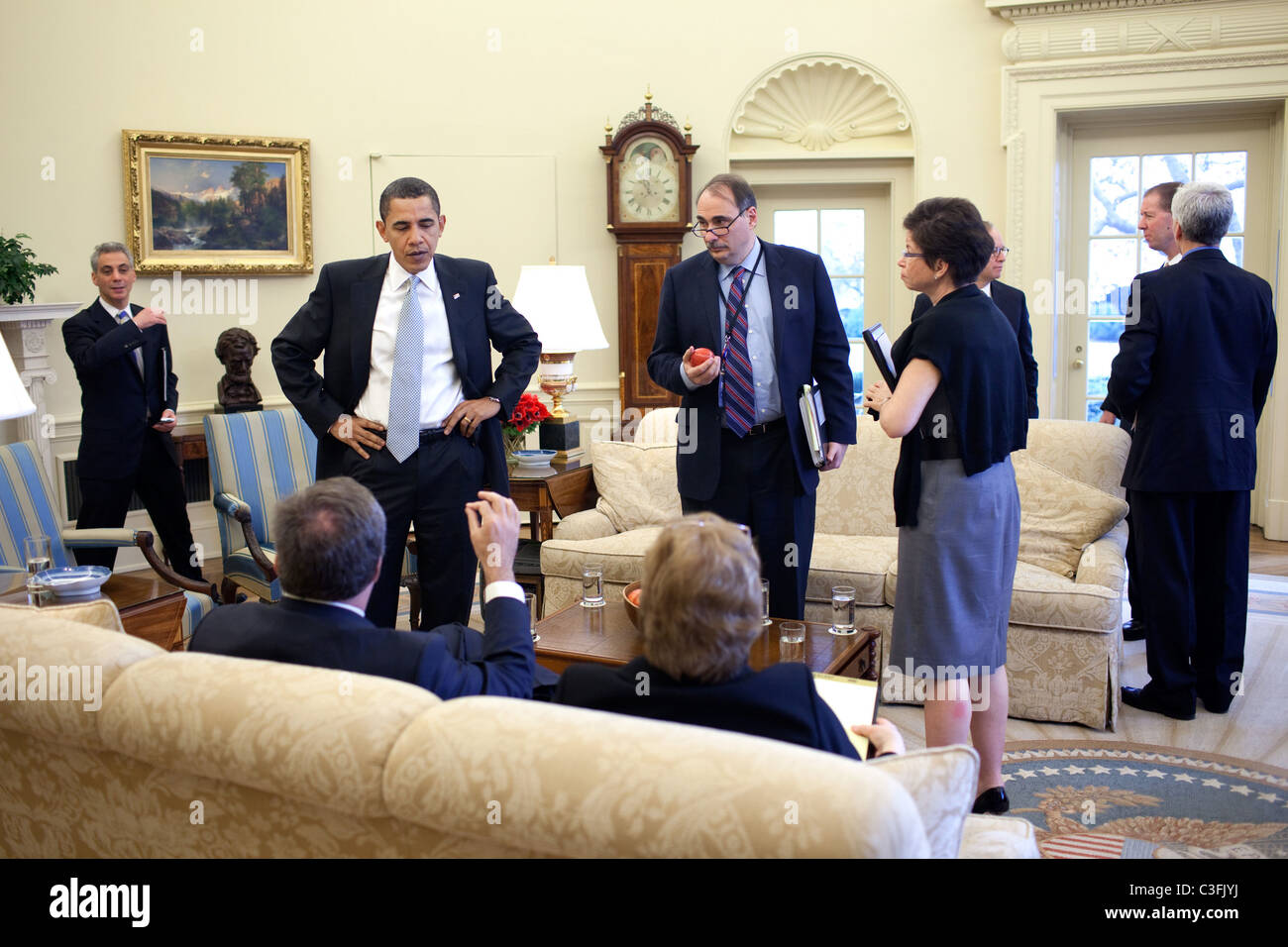 President Barack Obama at a briefing with advisors in the Oval Office ...