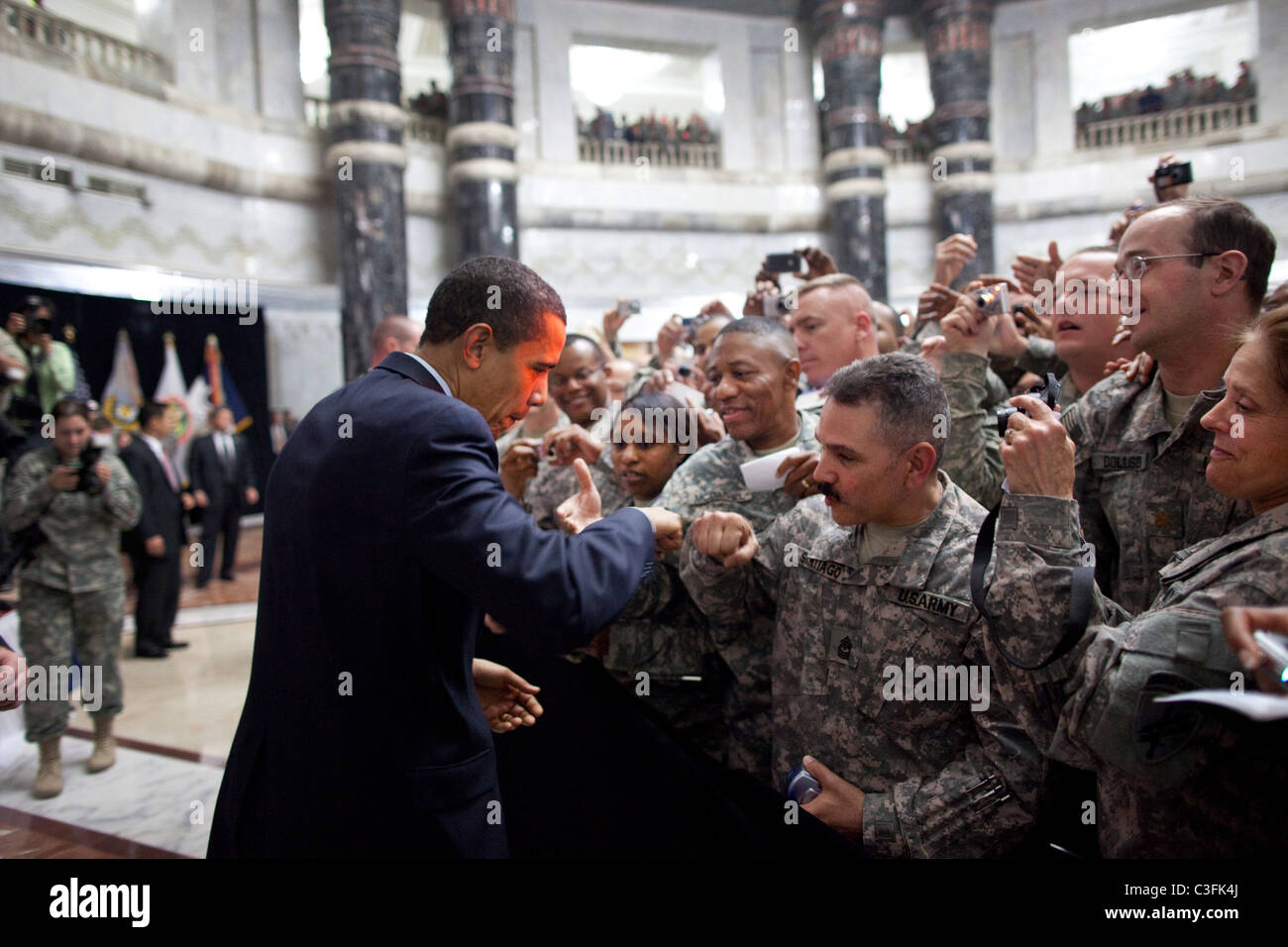 President Barack Obama receives a fist-bump from a U.S. soldier as he ...