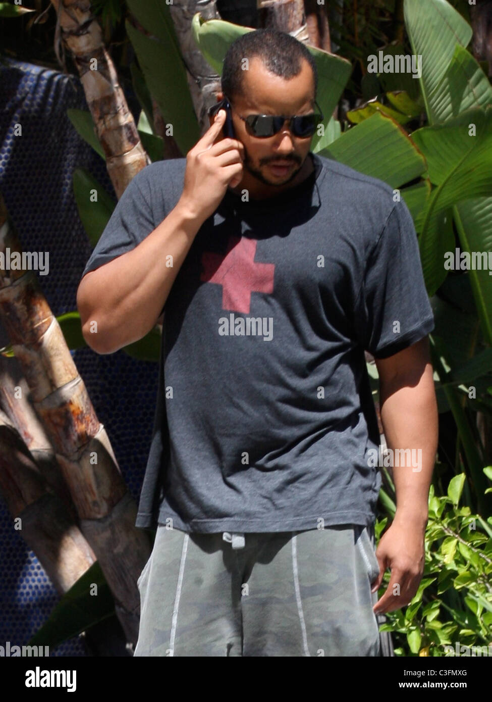 Donald Faison talking on his phone while out in West Hollywood Los ...