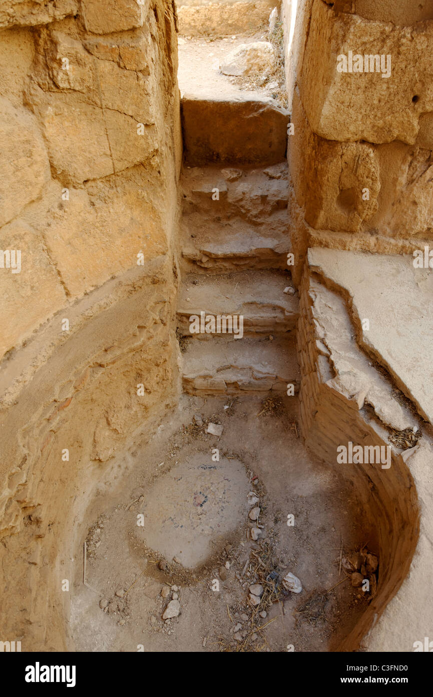 St Simeon. Syria. Steps lead down to the walk through baptismal font at ... St Simeon. Syria. Steps lead down to the walk through baptismal font at ...