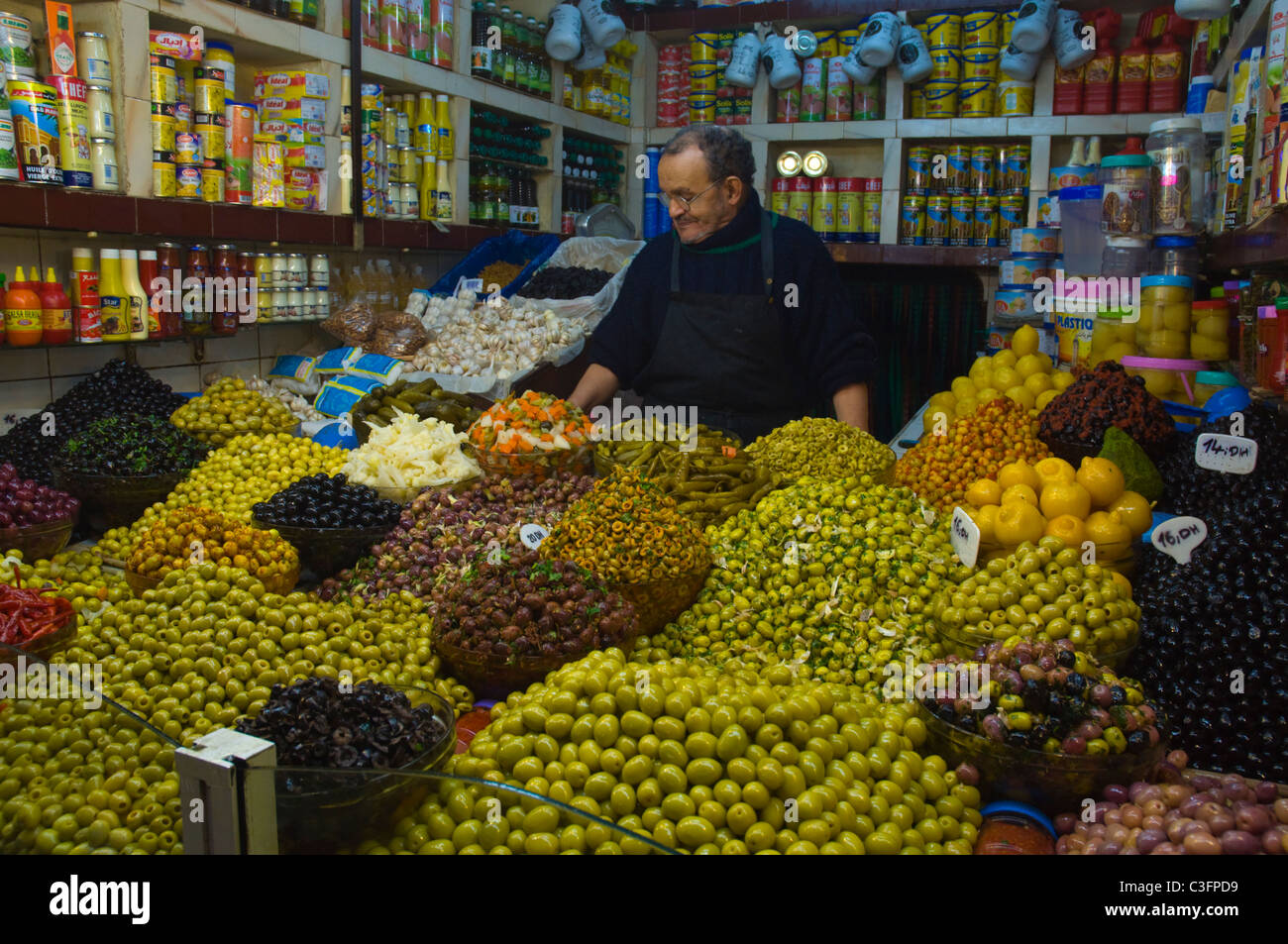 Stall selling olives and other locals foods inside covered markets ...
