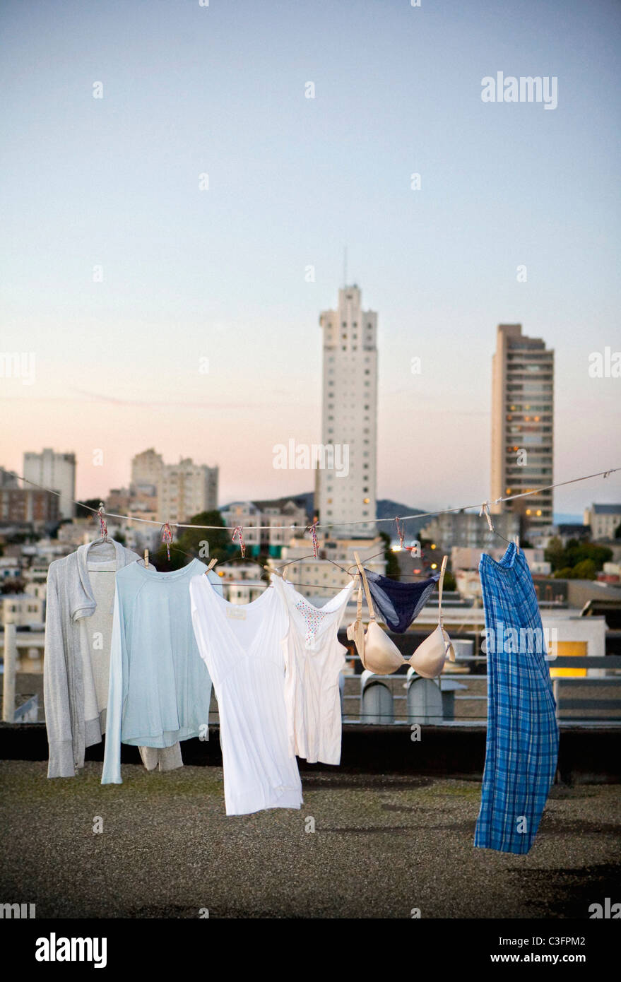 Laundry on clothes line on urban rooftop Stock Photo - Alamy
