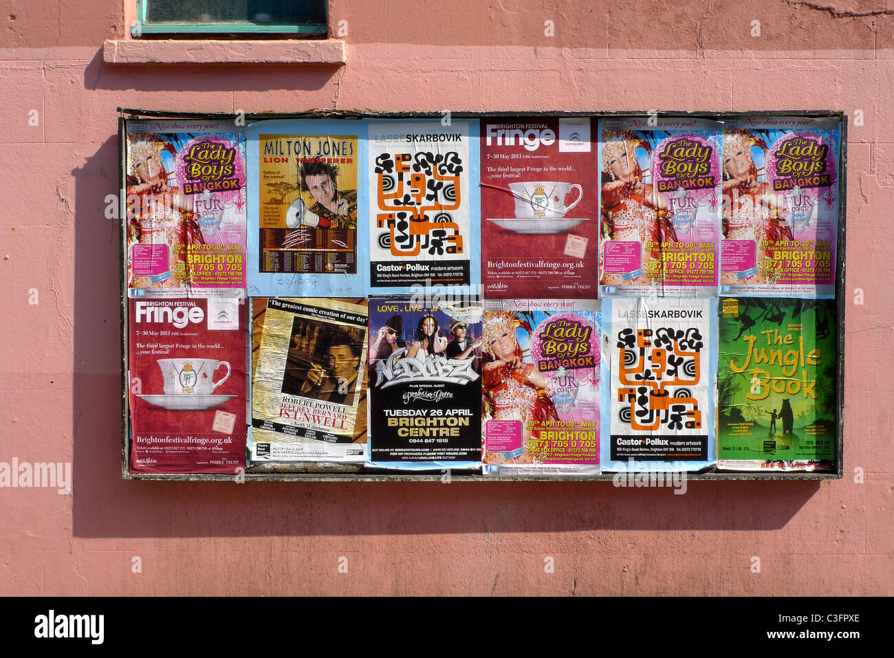 neat billboards on pink wall , Brighton, Sussex, England Stock Photo ...