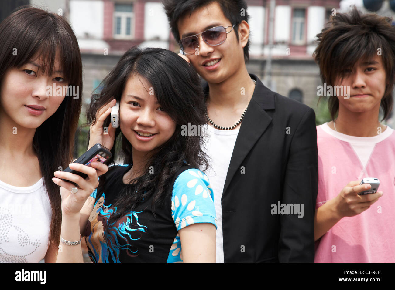 Brunette boy talking on cell hi-res stock photography and images - Alamy