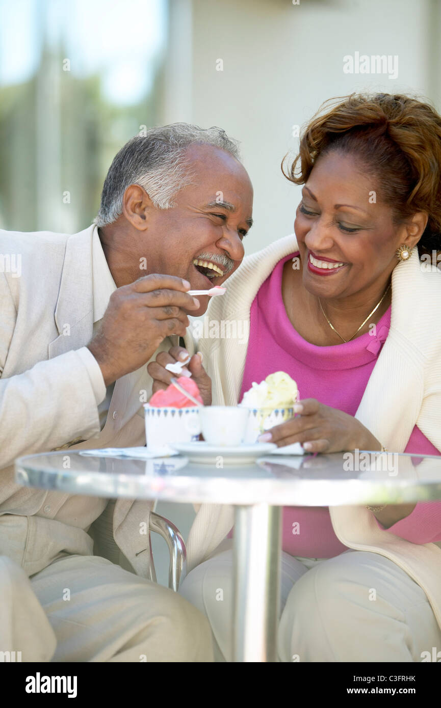 Couple eating ice cream together Stock Photo - Alamy