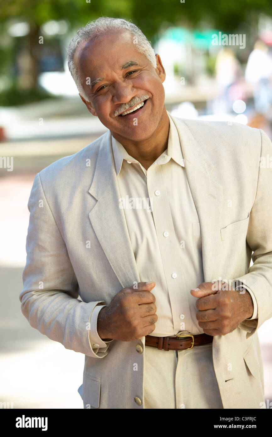 Smiling Hispanic man standing outdoors Stock Photo - Alamy