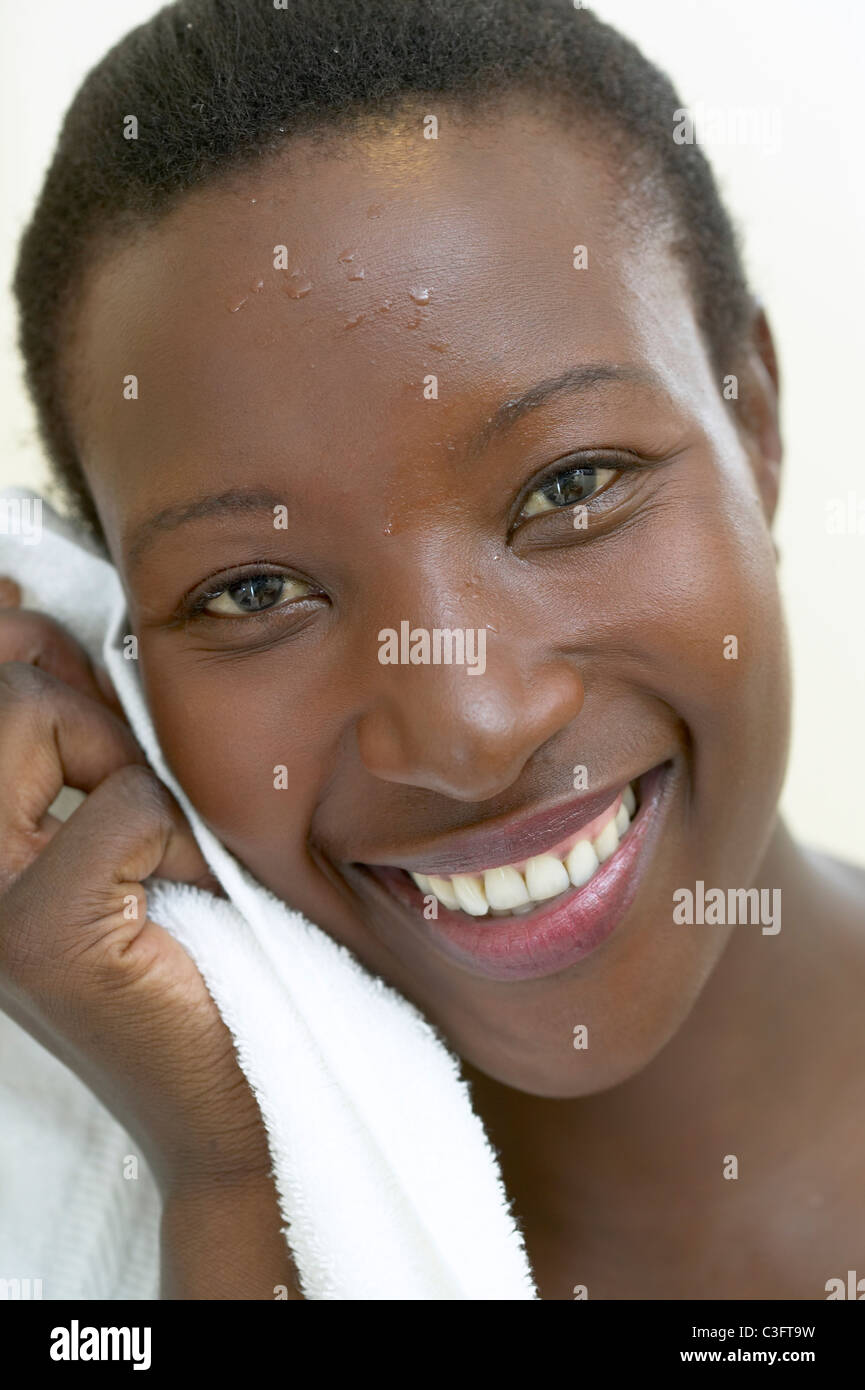 Sweating African American woman Stock Photo - Alamy