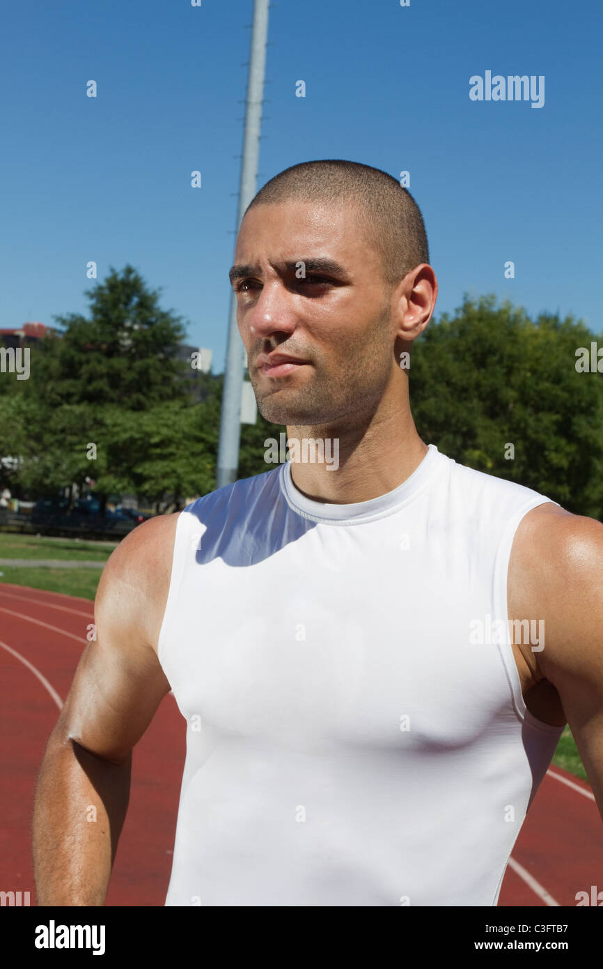 Mixed race athlete standing on track Stock Photo - Alamy