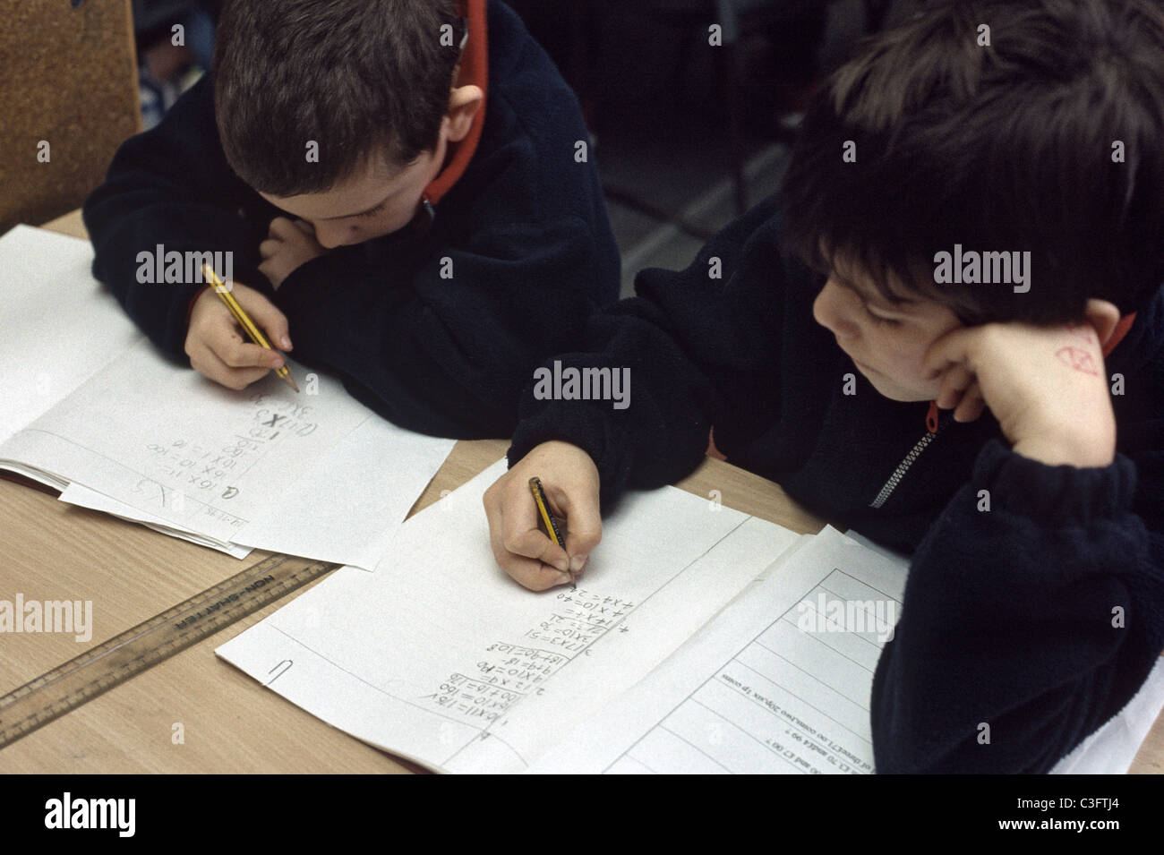 primary school boys working on math calculations Stock Photo - Alamy