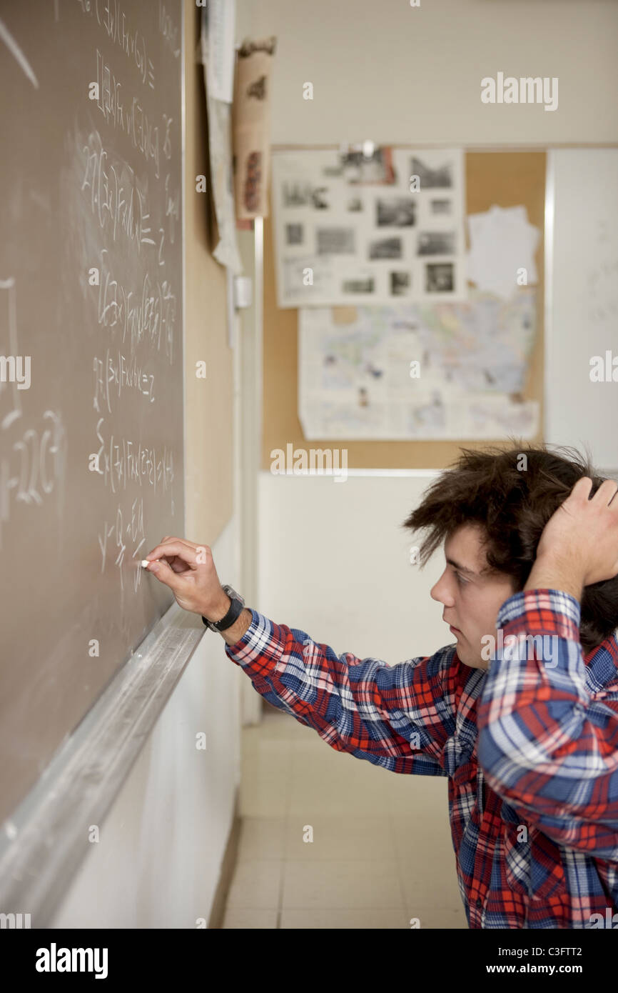 Student calculating at blackboard hi-res stock photography and images ...