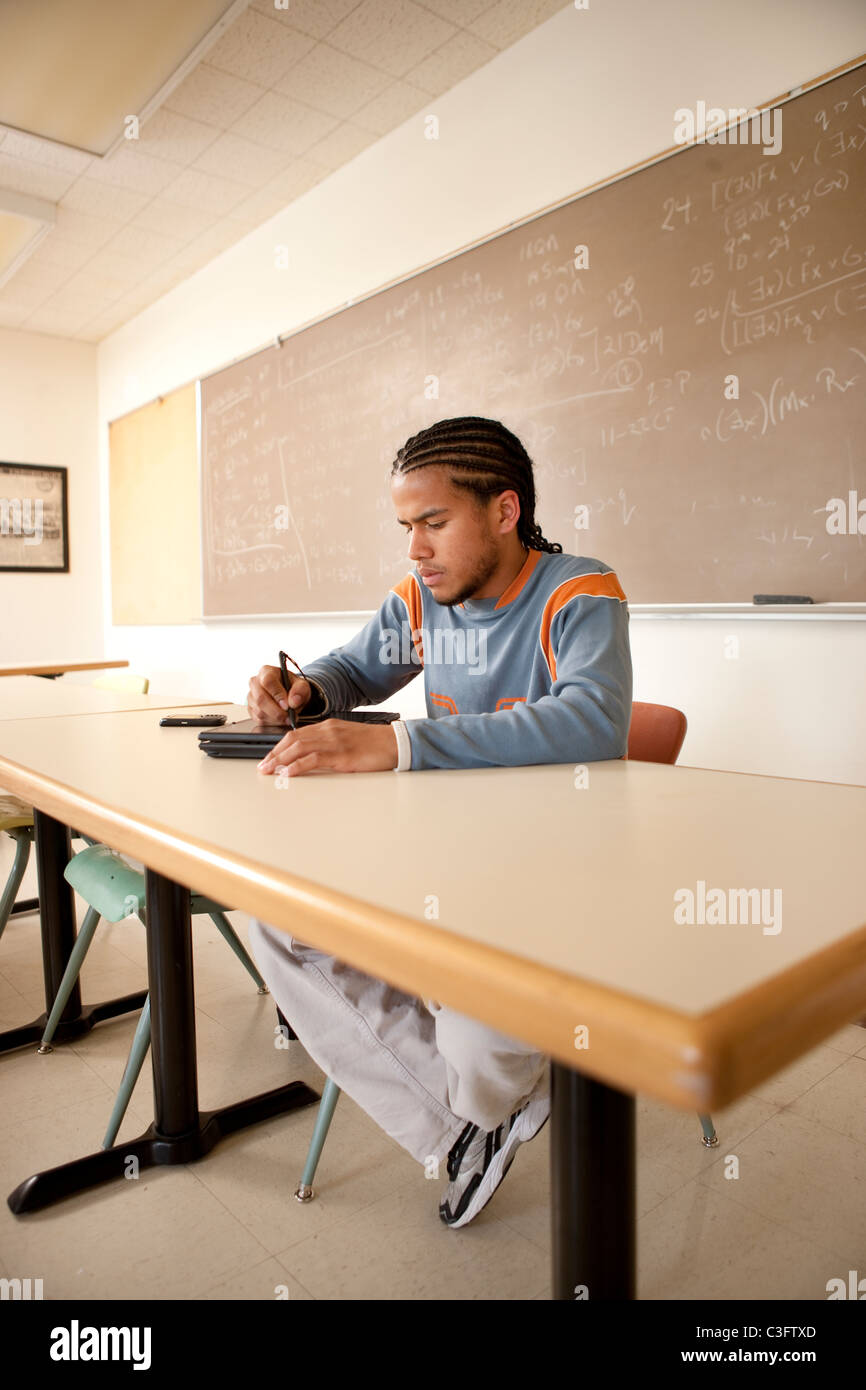 Peruvian student studying in classroom on laptop Stock Photo - Alamy