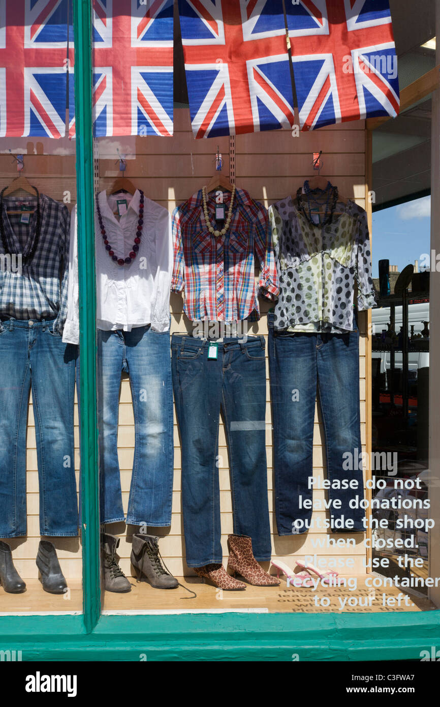 Union Jack flags hanging and clothing on sale in an Oxfam charity shop ...
