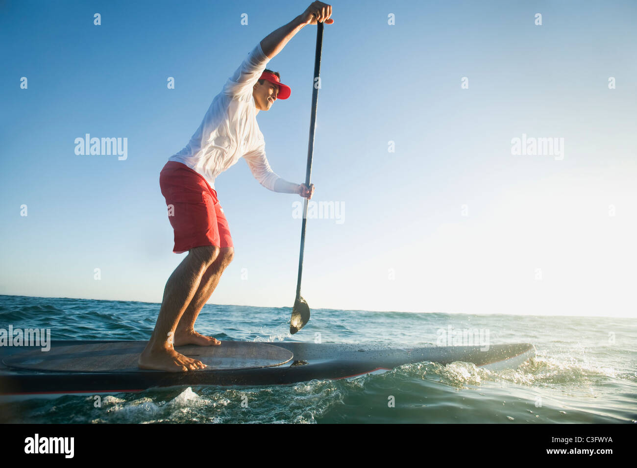 Surfer paddling with his arms hi-res stock photography and images - Alamy