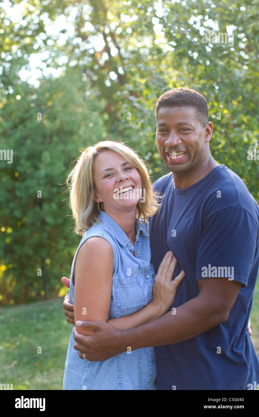 Interracial couple hugging hi-res stock photography and images - Alamy