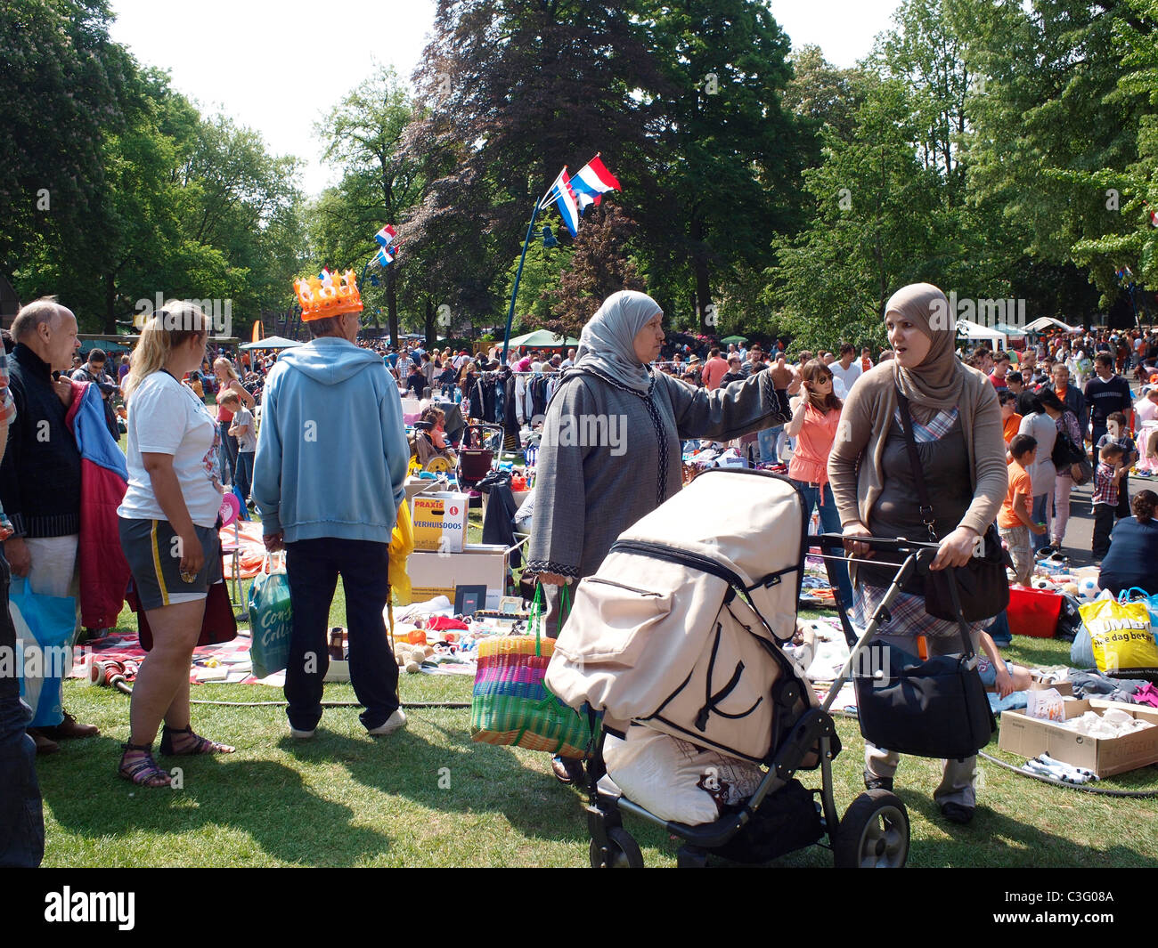 Integration, muslim women visiting the flea market on april 30th, queen ...