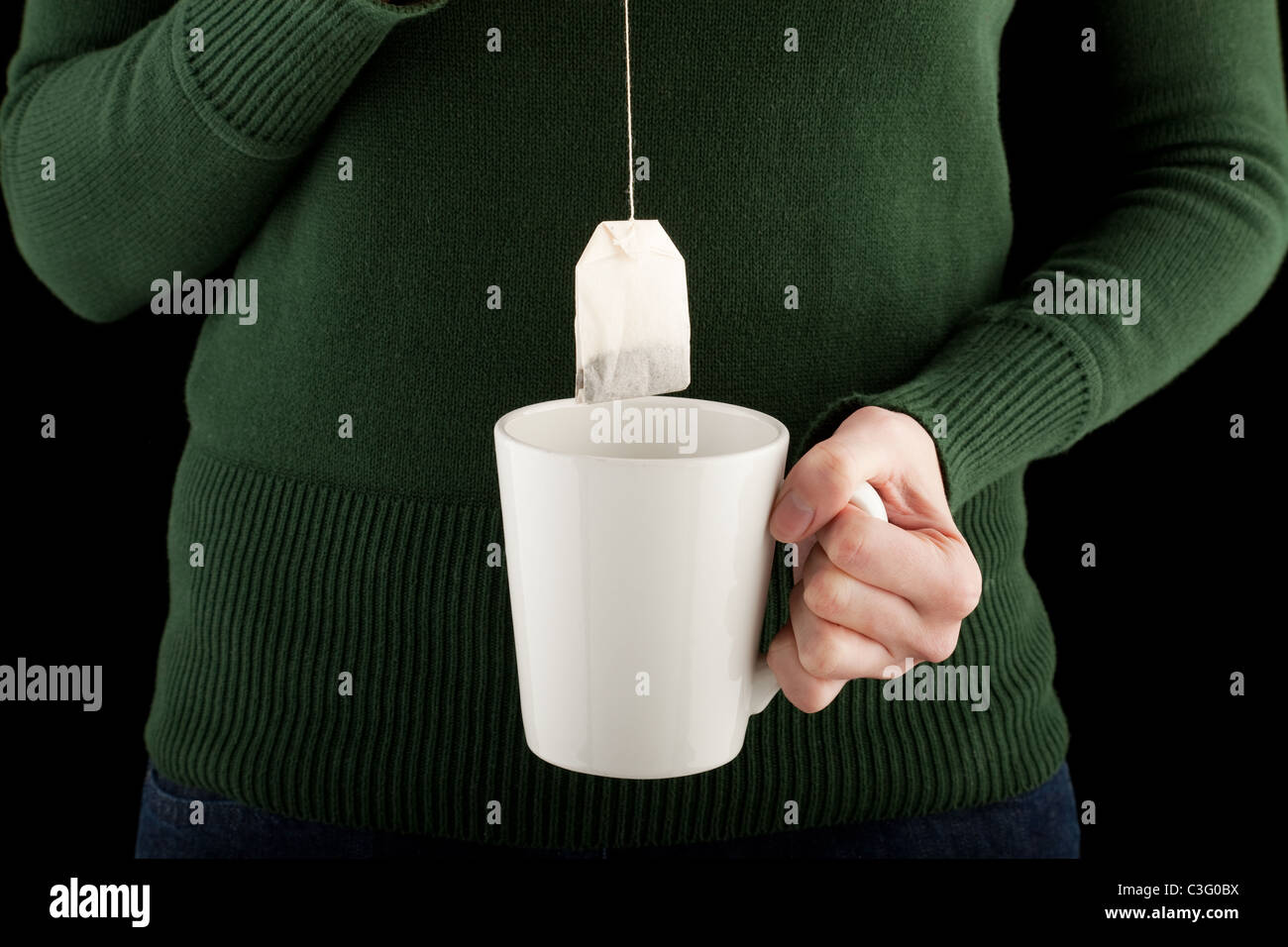 Woman holding teabag hi-res stock photography and images - Alamy