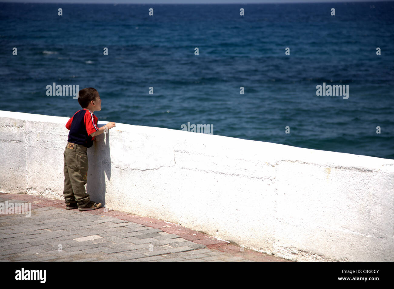 young boy shouting at the ocean Stock Photo - Alamy