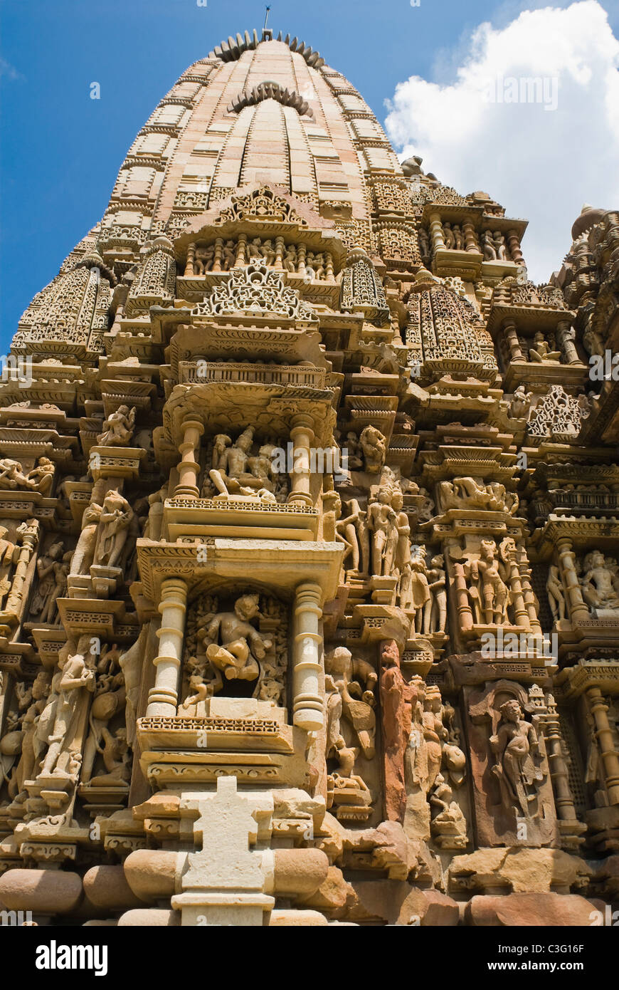 Sculptures on the wall of a temple, Khajuraho, Chhatarpur District ...
