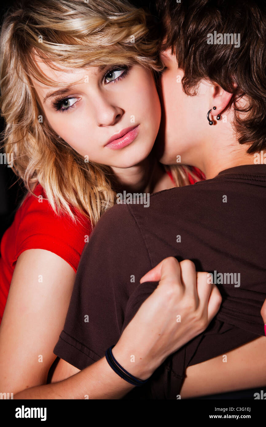 Caucasian couple hugging Stock Photo - Alamy