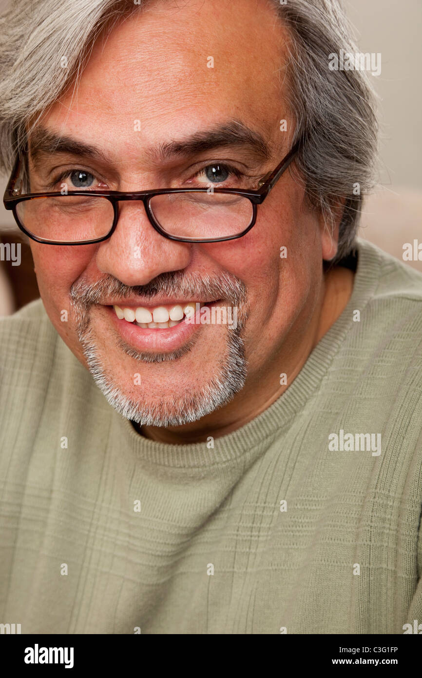 Smiling Hispanic man with goatee and eyeglasses Stock Photo - Alamy
