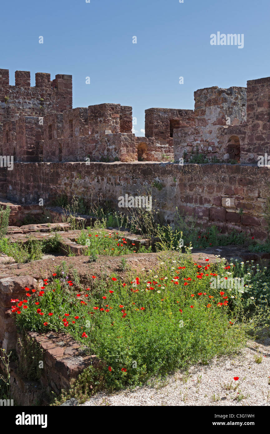 Silves Castle, Algarve, Portugal. Crenellated walls of the partially ...