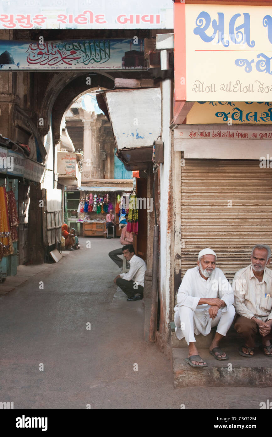 Group of people sitting in a street, Ahmedabad, Gujarat, India Stock ...