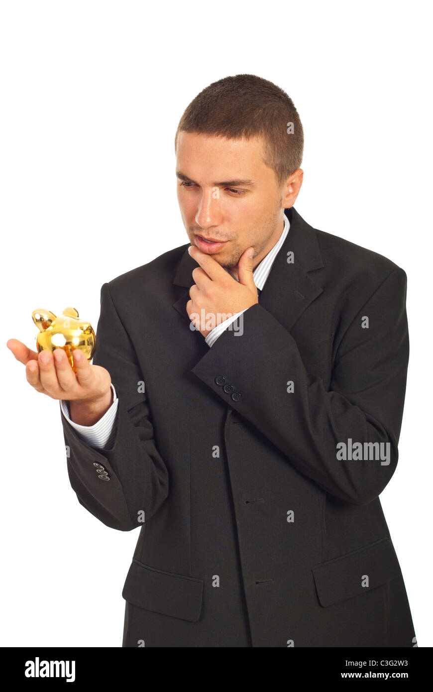 Thinking business man holding piggy bank isolated on white background ...