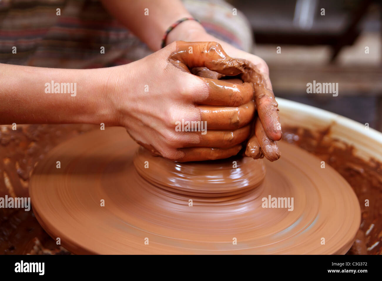 clay potter hands closeup working on wheel handcrafts pottery work ...