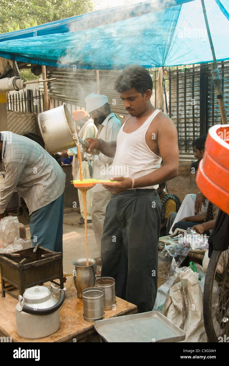 Indian Man Making Tea High Resolution Stock Photography and Images - Alamy