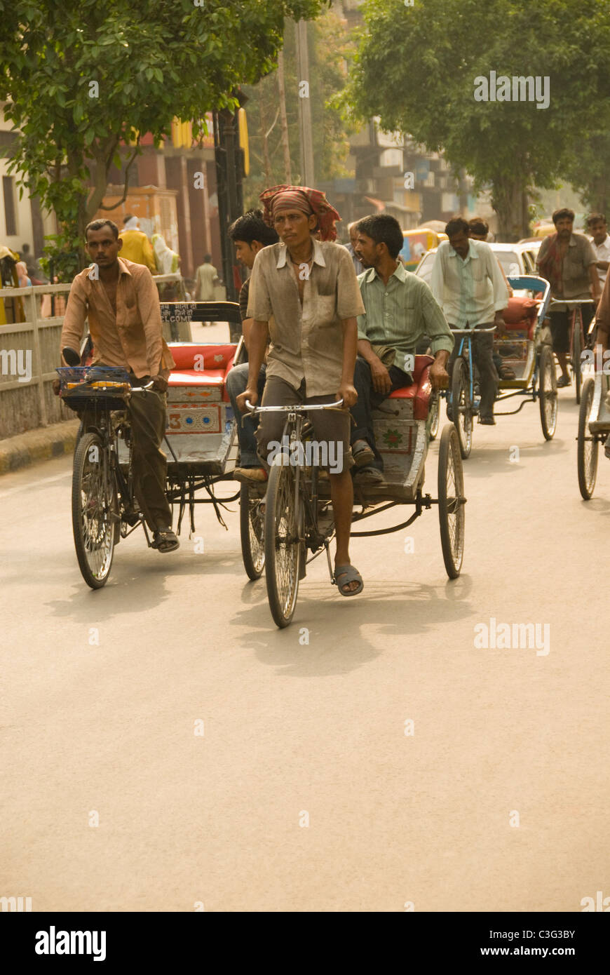 Rickshaw pullers on a street, Chandni Chowk, Delhi, India Stock Photo ...