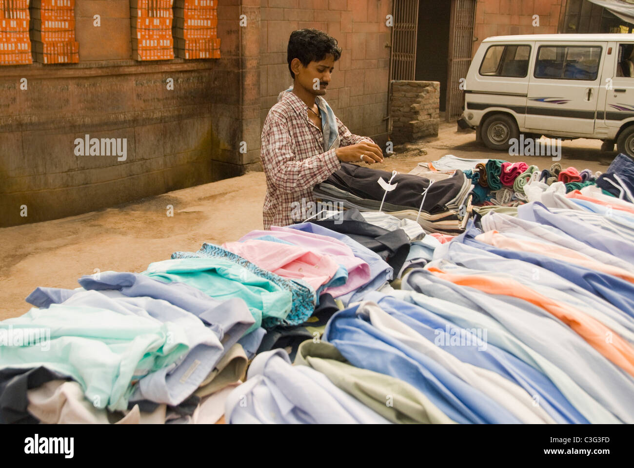 Man selling clothes at a street market, Chandni Chowk, Delhi, India ...