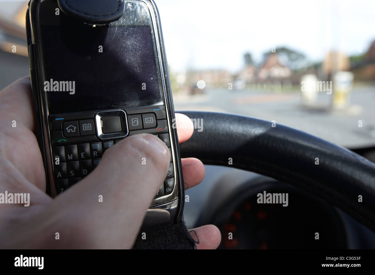 Using mobile at wheel uk hi-res stock photography and images - Alamy