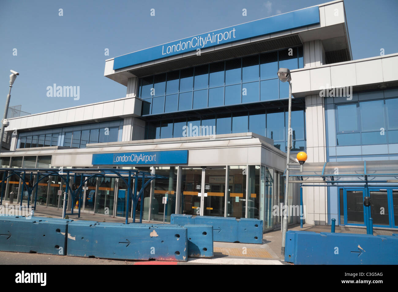The Main terminal entrance of London City Airport with concrete vehicle ...