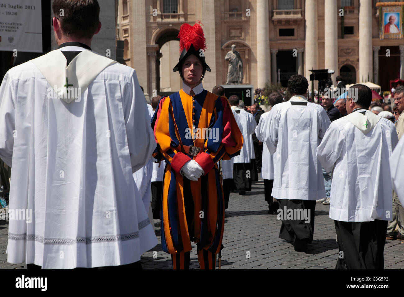 Priests giving out holy communion to faithful in Saint Peter's square ...