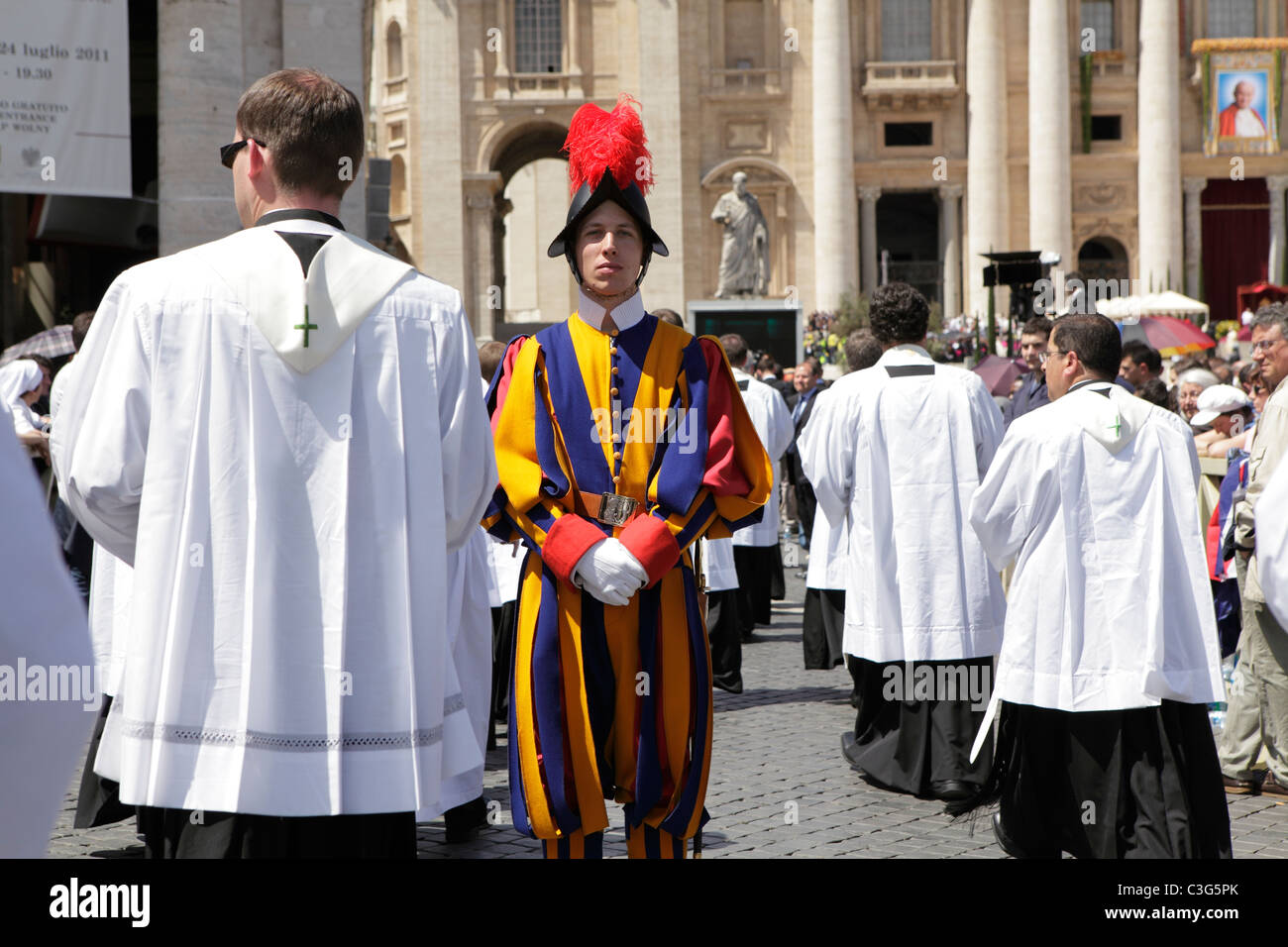 Priests giving out holy communion to faithful in Saint Peter's square ...